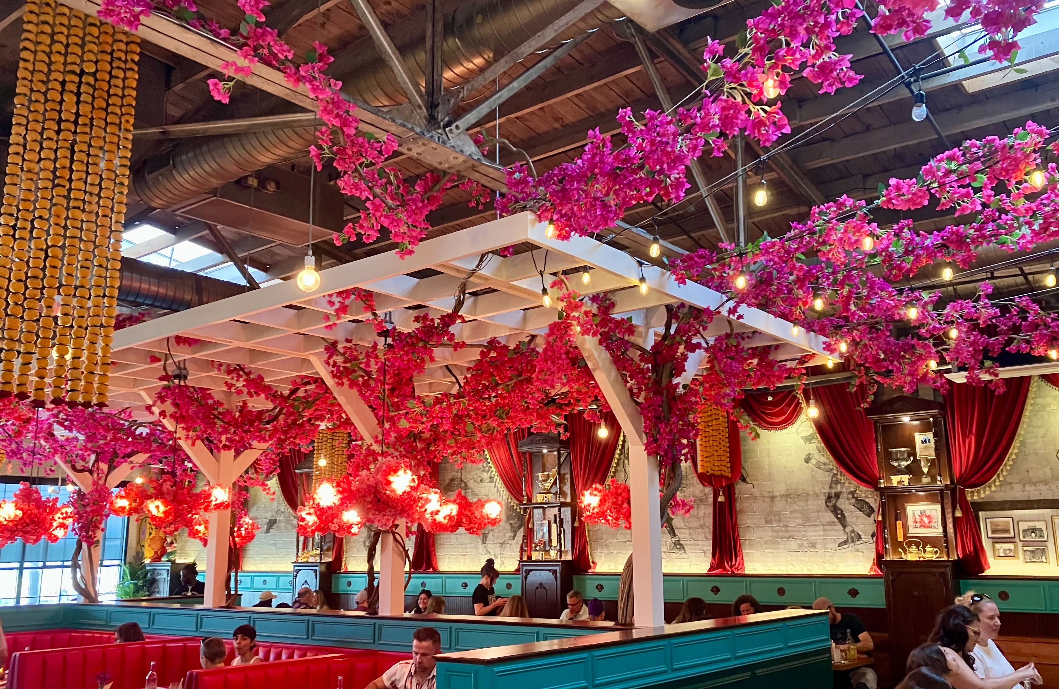 Colorful interior of Chai Pani restaurant in Asheville with pink ...